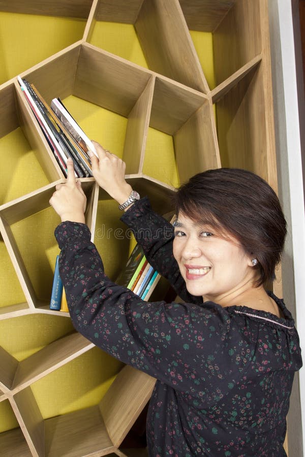 Arranging book stock photo. Image of school, casual, beautiful - 21132144