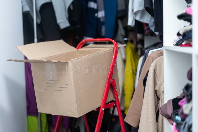 Arranging Clothes at Wardrobe, Moving Stock Photo - Image of cloth ...