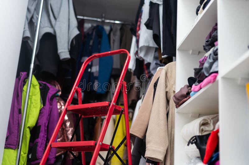 Arranging Clothes at Wardrobe, Moving Stock Photo - Image of closet ...