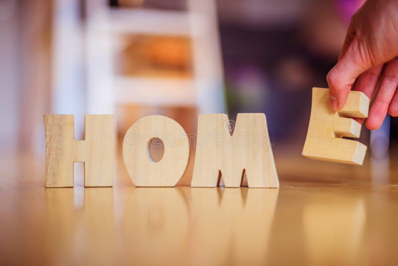 New Home: Arranging HOME Letters Stock Photo - Image of hand, homely ...