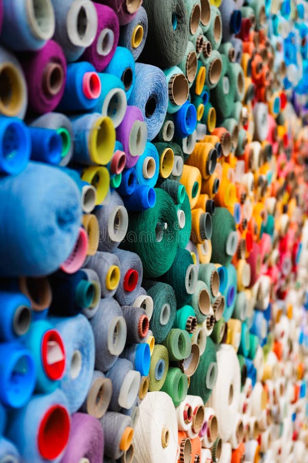 An Array of Colorful and Vibrant Spools of Thread Stacked Neatly in a ...