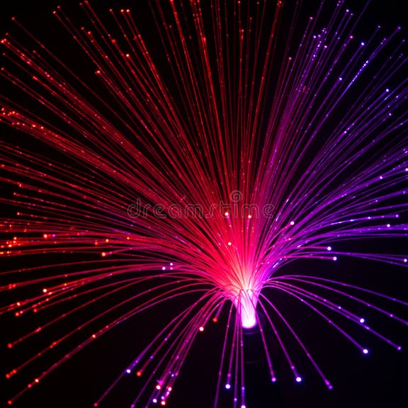 An Array of Fiber Optic Strands in a Dark Setting, Illuminated in Vivid ...