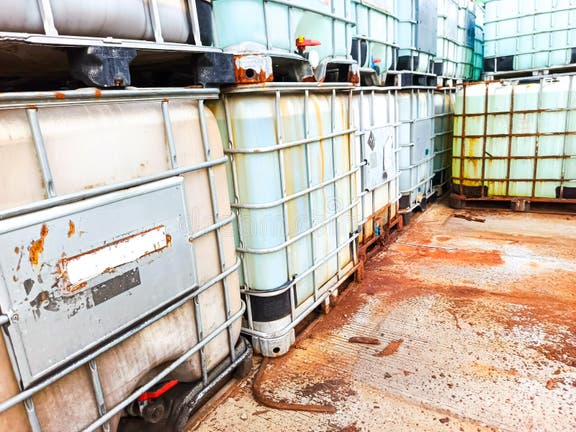 Stack of Industrial Liquid Containers Showcasing Logistics Storage and ...