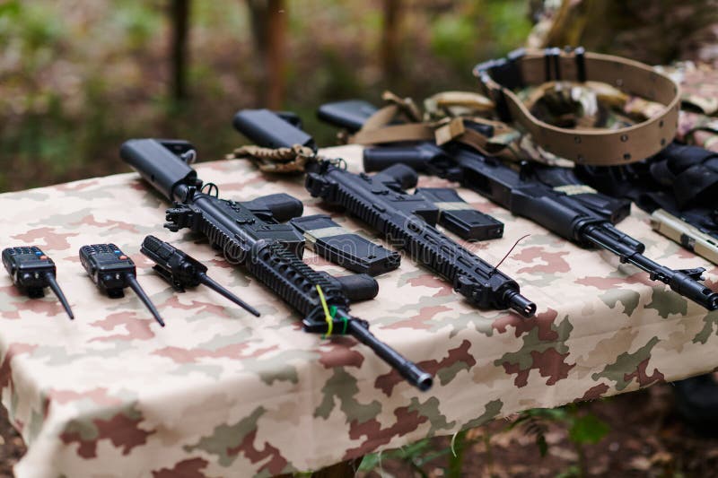 An Array of Military Weapons, Including Rifles and Pistols, is ...