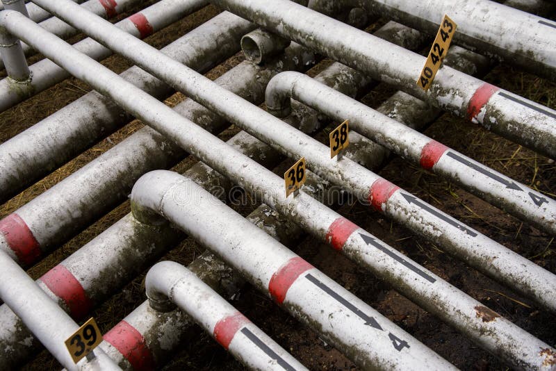 Array of Old Pipes with Arrows Stock Image - Image of construction ...