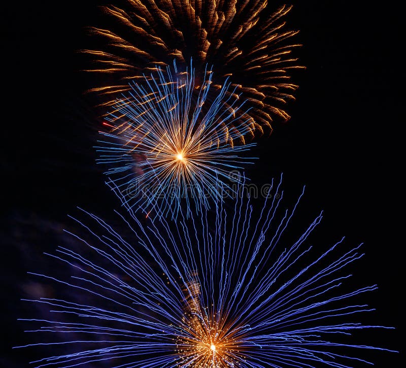 Three Vertical Fireworks Bursts Stock Image - Image of yellow, large ...