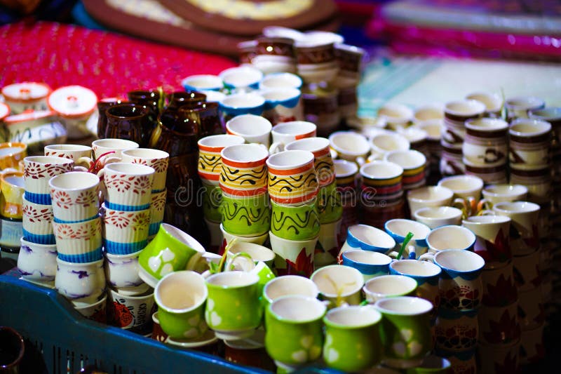 Many Different Colored Cups are Placed on the Table Together with Each ...