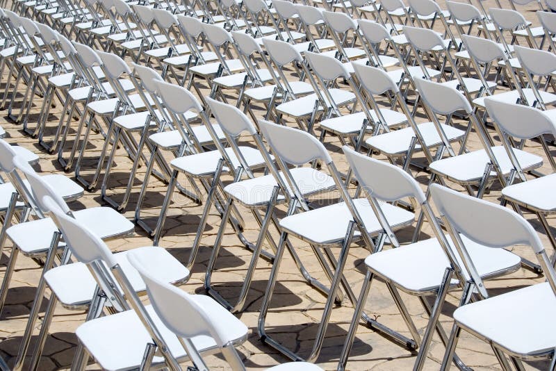Array of White Chairs stock photo. Image of spectator - 2531976