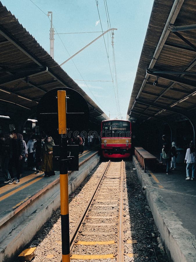 The Arrival of a Commuter Line at a Train Station in Jakarta Editorial ...