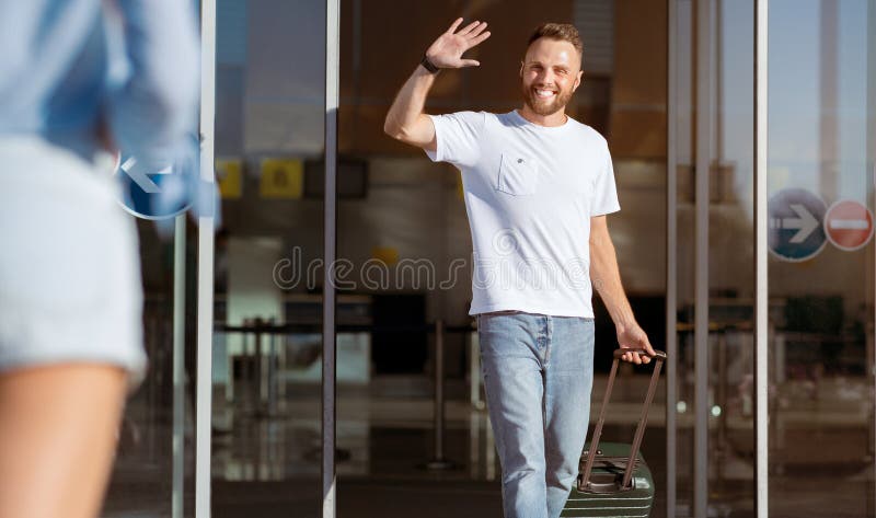 Arriving at Airport. Young Man Greeting Girlfriend Stock Image - Image ... Arriving at Airport. Young Man Greeting Girlfriend Stock Image - Image ...