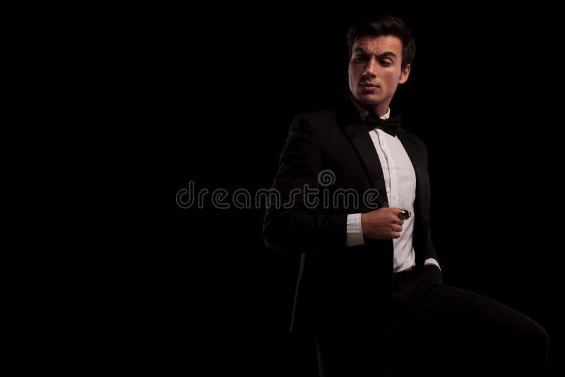 Arrogant Young Man in Tuxedo and Bowtie Looking Back Stock Photo ...