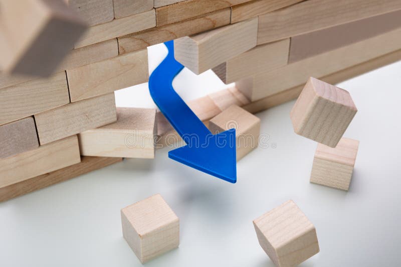 Arrow Breaking through Wall Made of Wooden Blocks Stock Image - Image ...