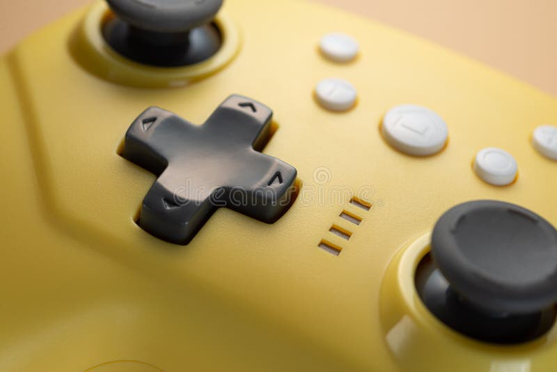 Arrow Buttons of a Yellow Game Controller Close-up. Game Development ...