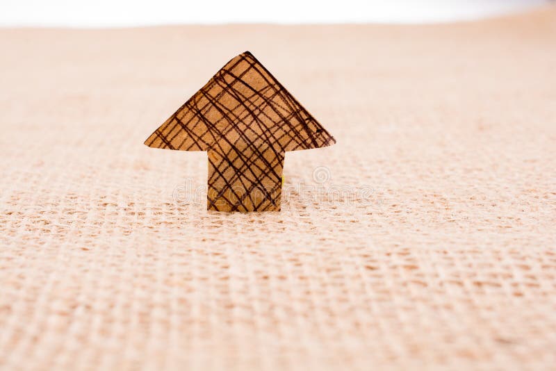 Arrow Cut Out of Brown Paper Stock Image - Image of arrow, direction ...