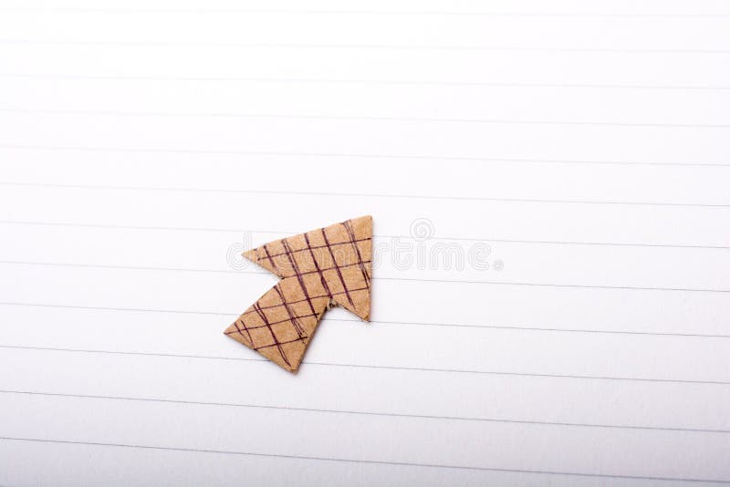 Arrow Cut Out of Brown Paper Stock Photo - Image of arrow, paper: 95871032
