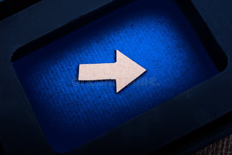 Arrow Cut Out of Brown Paper Stock Photo - Image of choice, refresh ...