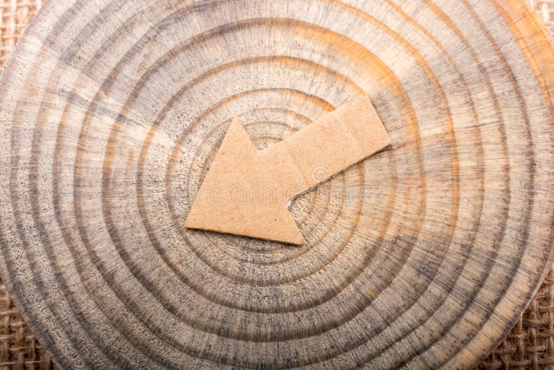 Arrow Cut Out of Brown Paper Stock Image - Image of button, abstract ...