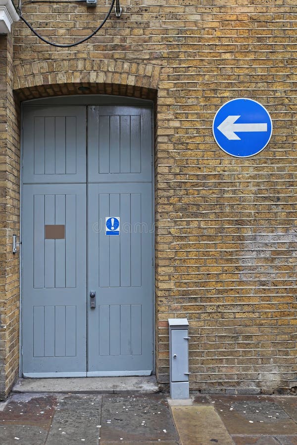Arrow and Door stock photo. Image of house, bricks, brick - 129170402