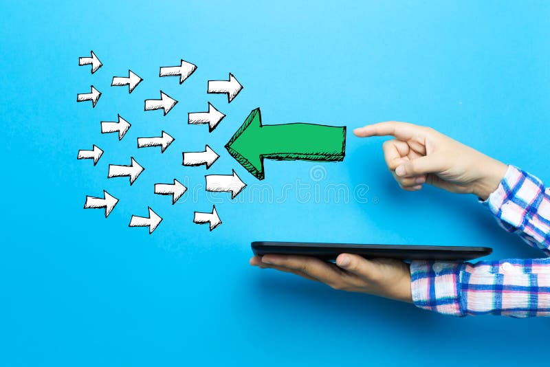 Arrow Facing in a Opposite Direction with a Tablet Computer Stock Photo ...