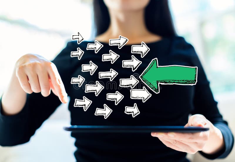 Arrow Facing in a Opposite Direction with Woman Using Tablet Stock ...