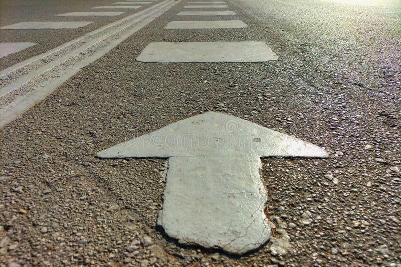 An Arrow on the Footpath Indicating, Controlling the Direction of ...