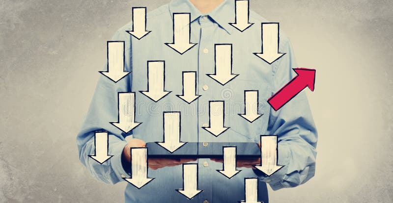 Arrow Going in a Different Direction with Man Holding a Tablet Stock ...