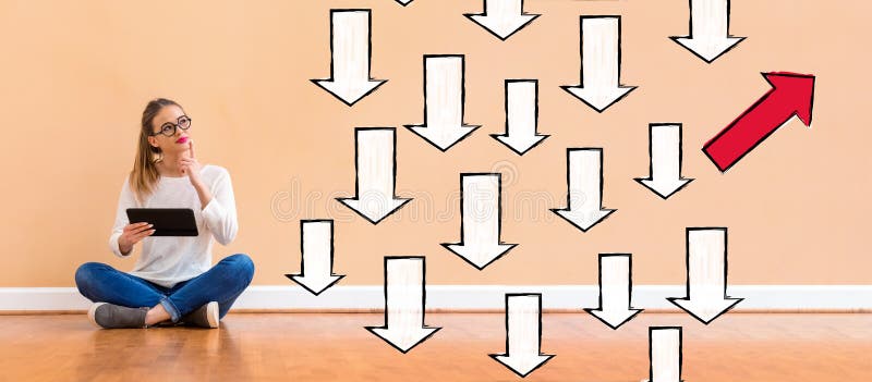 Arrow Going in a Different Direction with Woman Using a Tablet Stock ...