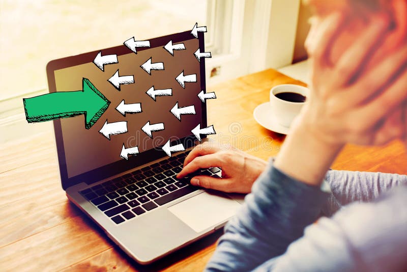 Arrow Going in the Opposite Direction with Man Using a Laptop Stock ...