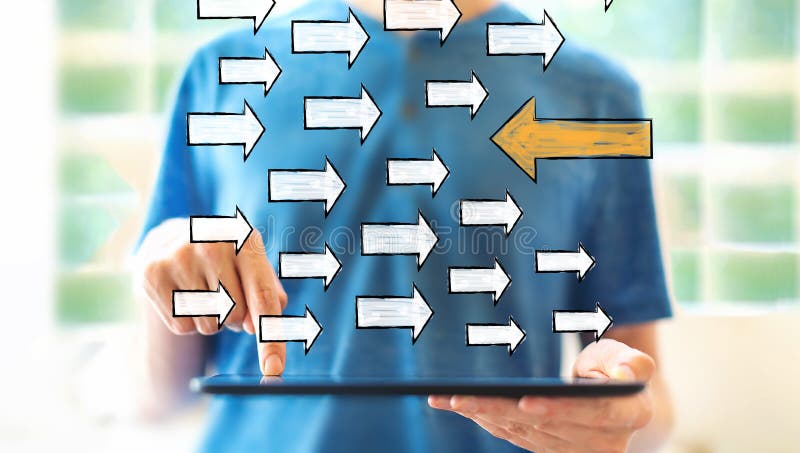 Arrow Going in the Opposite Direction with Man Using a Tablet Stock ...