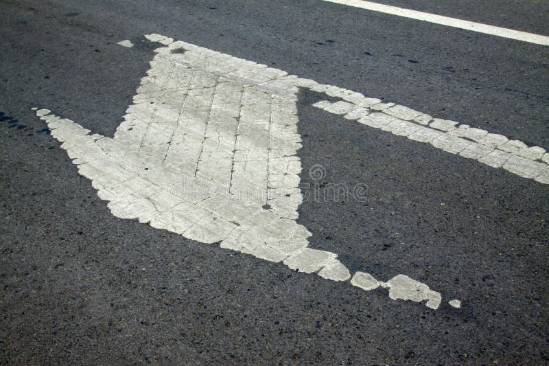 Arrow Mark on Asphalt Pavement, Closeup Photo Stock Image - Image of ...
