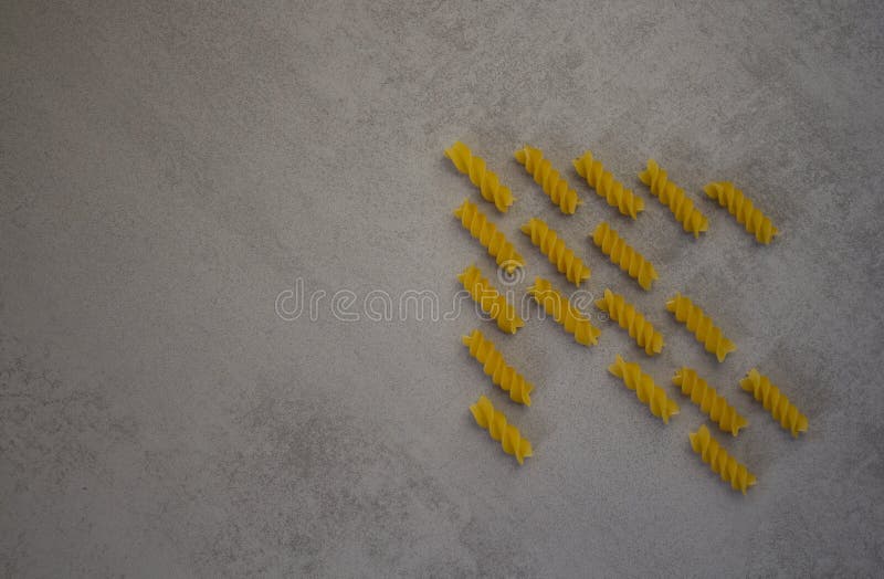 Arrow of Pasta on a Blue Background Stock Photo - Image of graphic ...