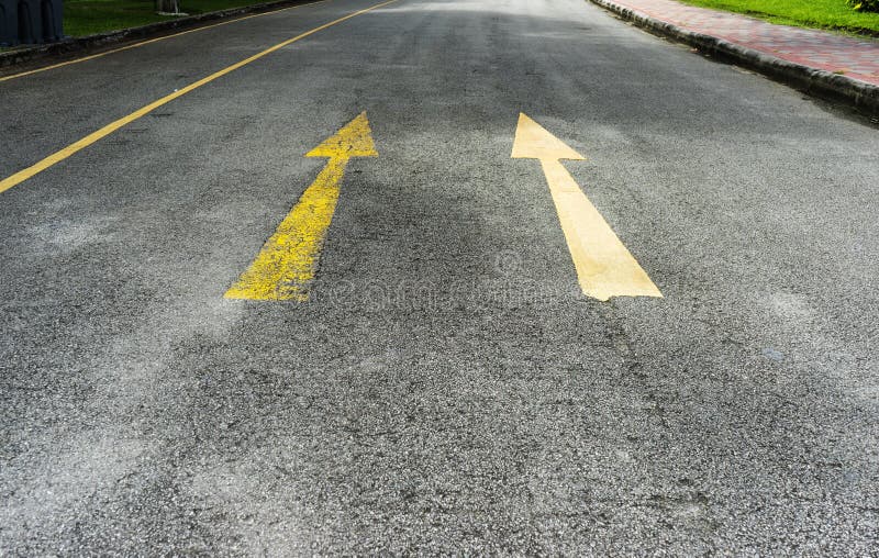 Arrow on the Road and Yellow Color Stock Image - Image of direction ...