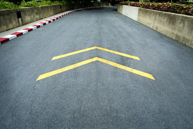 Arrow on the Road and Yellow Color Stock Photo - Image of line, road ...