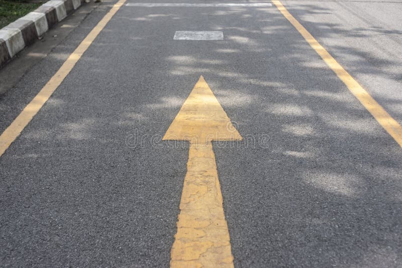 Arrow on the Road and Yellow Color Stock Photo - Image of city, path ...
