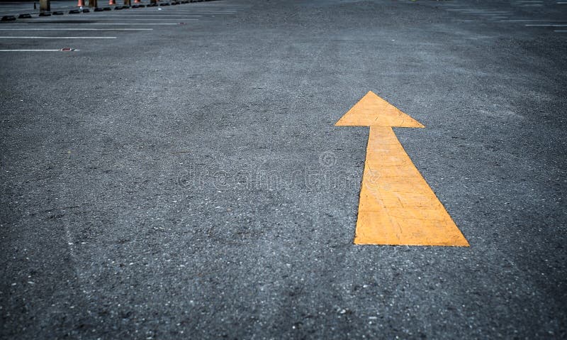 Arrow on the road, yellow stock image. Image of pointing - 64157017