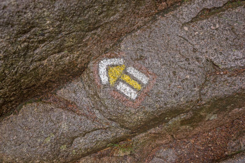 Arrow on Rock stock photo. Image of yellow, navigation - 58506242