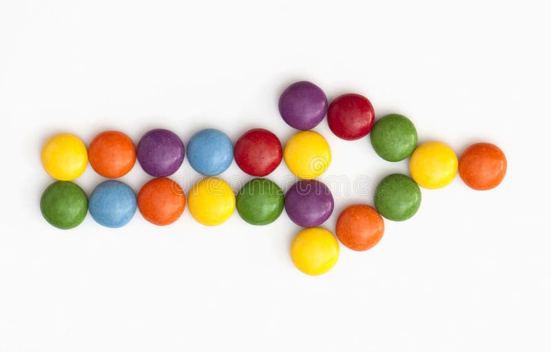 Arrow Shape of Colorful Candies Stock Photo - Image of assortment ...