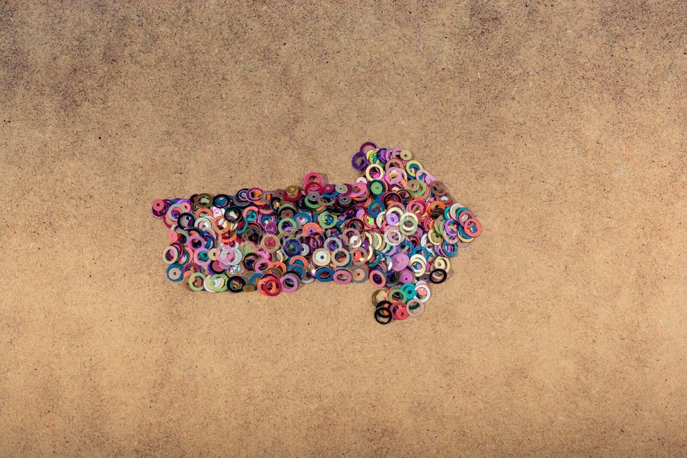 Arrow Shape Formed Out of Tiny Bright Objects Stock Photo - Image of ...