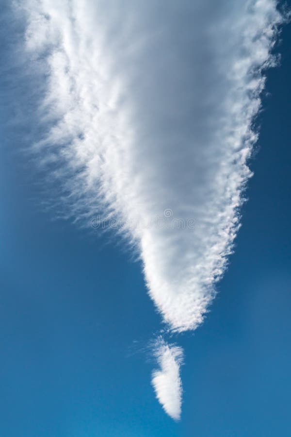 Arrow Shaped Cloud Against a Blue Sky Stock Image - Image of ...