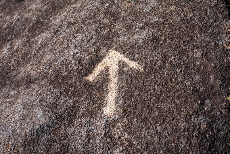 Arrow Showing the Way in a Rock Stock Image - Image of indicator ...
