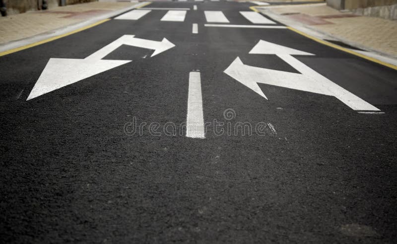 Arrow sign on the asphalt stock image. Image of guidance - 183087505