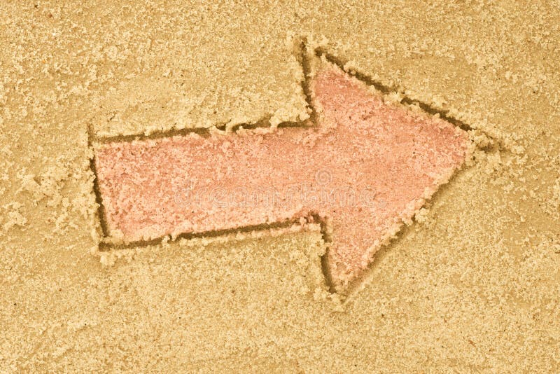 Arrow sign drawing on sand stock photo. Image of detail - 41175394