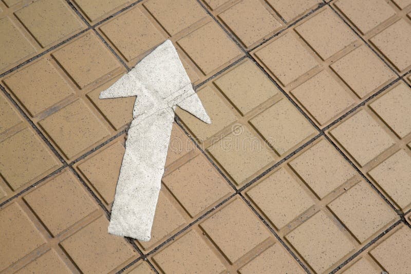 Arrow Sign on Pavement stock image. Image of direction - 191538669