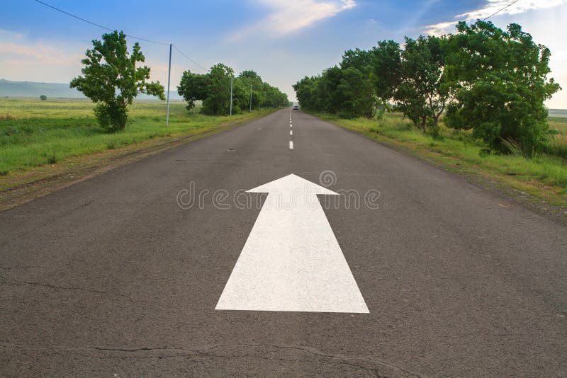 Arrow Sign Pointing Forward Long Empty Straight Road Stock Photos ...
