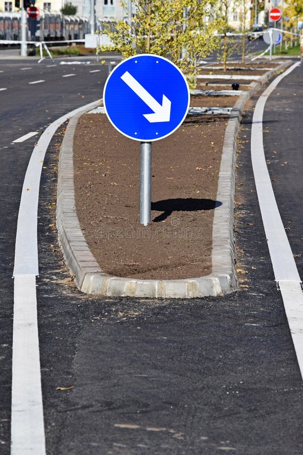 Arrow Sign at the Road Crossing Stock Image - Image of arrow, signal ...