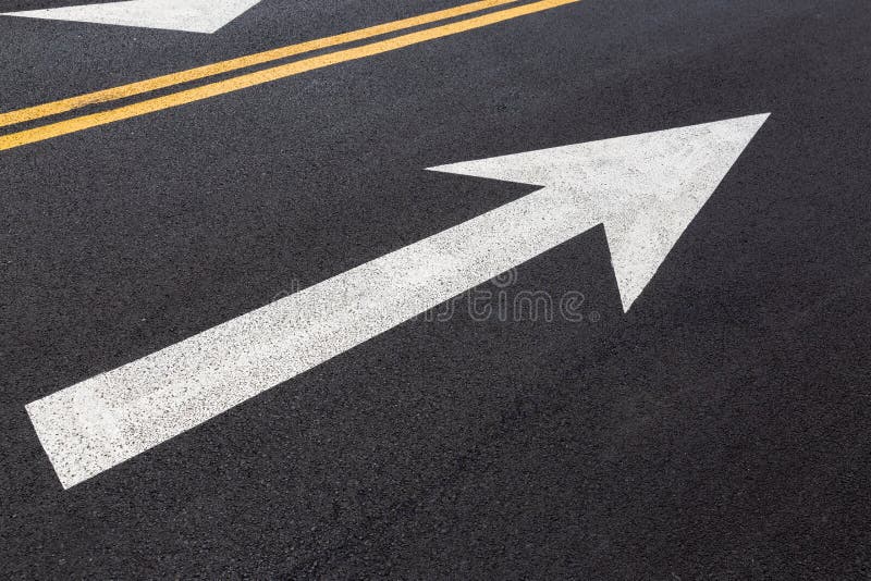 Arrow sign on a road stock photo. Image of road, roadway - 168501958