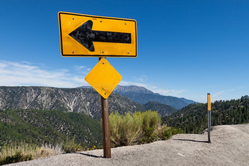 Arrow Sign on Top of High Altitude Cliff Stock Image - Image of curve ...