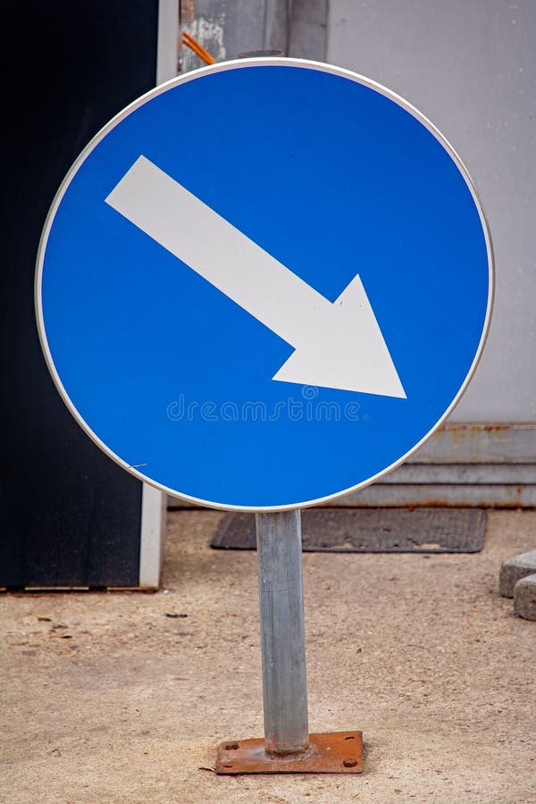 Arrow Traffic Sign in a Circle Stock Image - Image of outdoors, symbol ...
