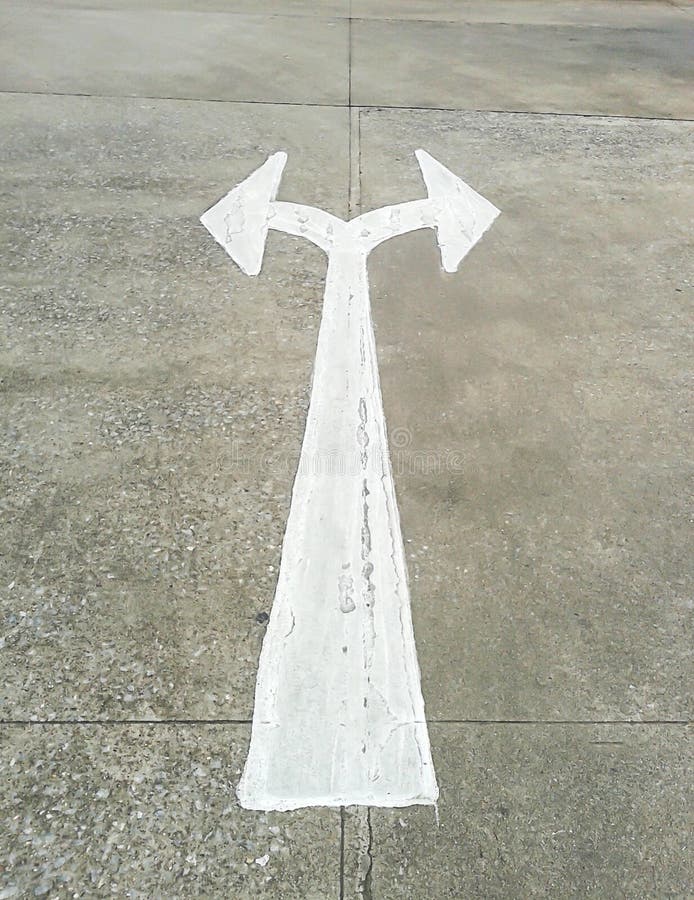 Arrow in Two Directions on Asphalt Stock Image - Image of doubt, sign ...