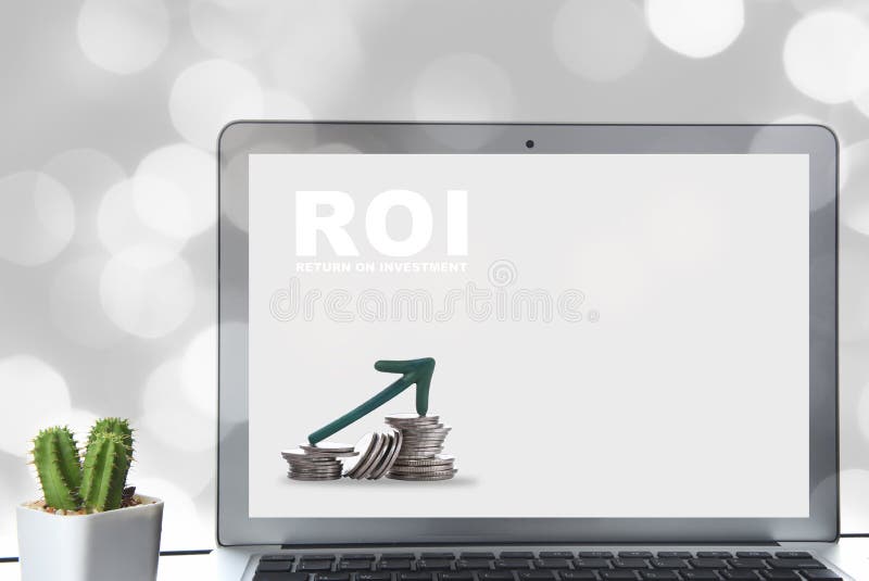 Arrow Upwards on Stack of Coins and Growth Graph on Computer Laptop on ...